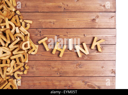 Think concept with letters on wooden cubes Stock Photo - Alamy