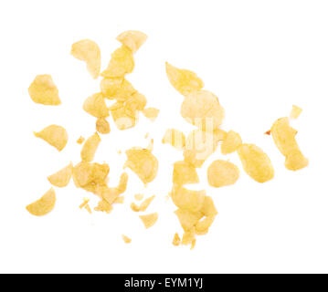Potato chips crumbs and leftovers isolated over the white background ...