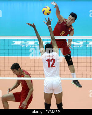 Tehran, Iran. 31st July, 2015. Saud Almamari (R) of Oman spikes the ball during the match ...
