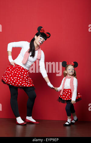 two girls with mouse masks Stock Photo - Alamy