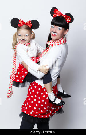 two girls with mouse masks Stock Photo - Alamy