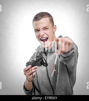 Guy young adult man gamer playing video game on game console hold ...