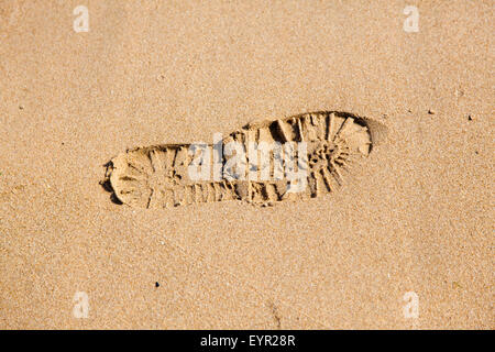 Boot print in the sand Stock Photo - Alamy