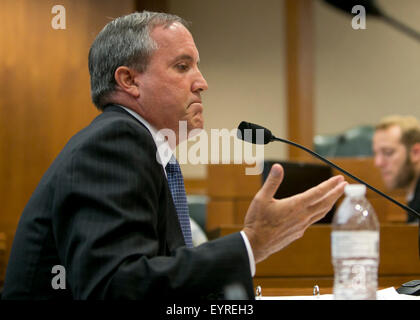 Texas Attorney General, Ken Paxton speaks with attendees during a meet ...
