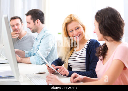 View of Young attractive people working together at the office Stock ...