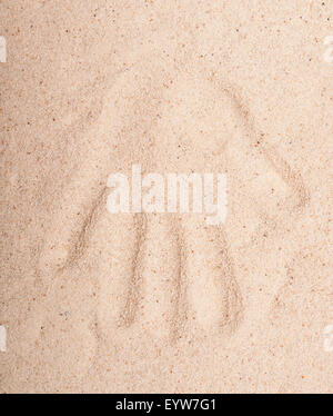Handprint in the sand Stock Photo - Alamy