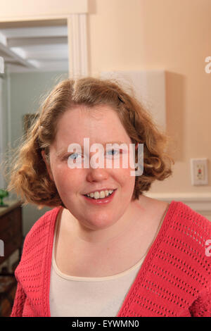 Smiling portrait of a young woman with Autism Stock Photo - Alamy