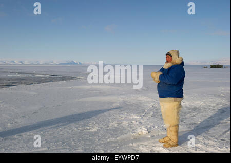 Inuit/Inughuit subsistence hunter in traditional clothing for winter ...