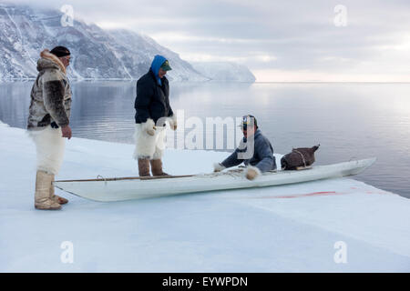 Inuit hunters use a kayak with a sealskin float to retrieve seals ...