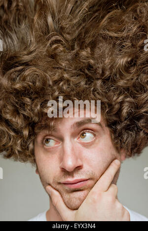 Scruffy faced man with messy curly hair afro Stock Photo - Alamy