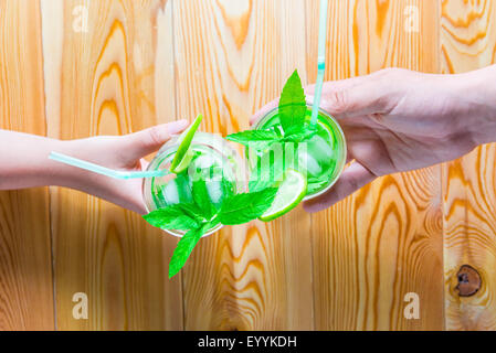 male hand with glass of mojito Stock Photo - Alamy