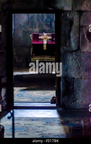 Ancient altar adorned with intricate designs captures sacred light in a ...