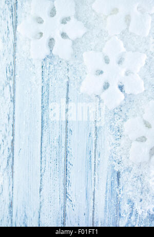 snowfolk and snow on white wooden background Stock Photo - Alamy