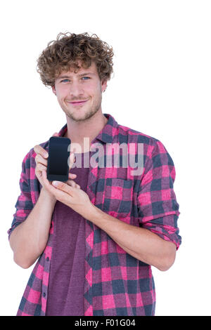 Young handsome man showing smartphone screen pointing and showing with ...