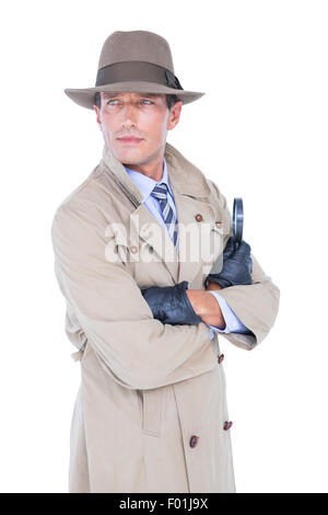 Spy looking through magnifier Stock Photo - Alamy