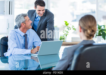 Business people speaking together during meeting Stock Photo - Alamy