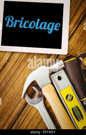 Bricolage against desk with tools Stock Photo - Alamy