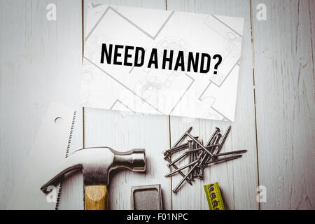 Need a hand? against blueprint Stock Photo - Alamy