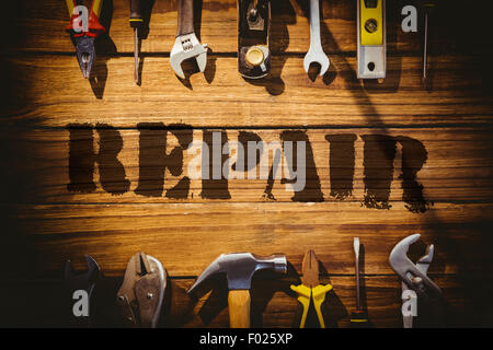 Repair against desk with tools Stock Photo - Alamy