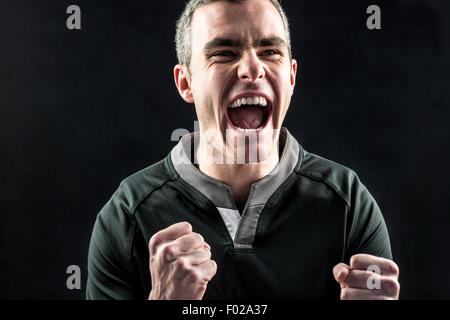 Excited rugby player yelling out Stock Photo - Alamy