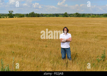 A man stands on the rye field Stock Photo - Alamy