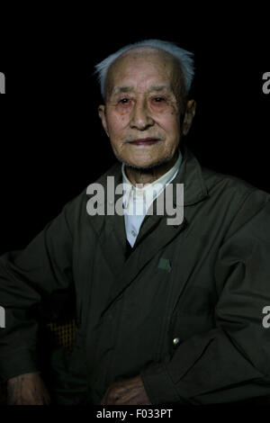 Chongqing, China. 31st Mar, 2015. Workers restore a sculpture of ...