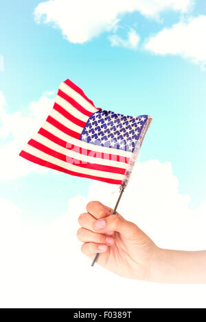 Composite image of hand waving american flag Stock Photo - Alamy