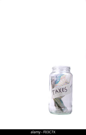 British Pounds banknotes in a glass jar over white background Stock ...