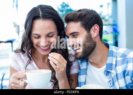 Cute couple having coffee together Stock Photo - Alamy