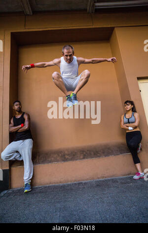 Group of people doing parkour in the city Stock Photo - Alamy