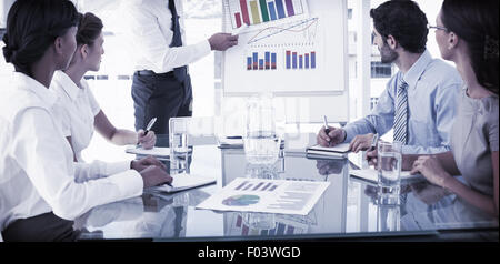 African American man giving presentation to colleagues at international ...