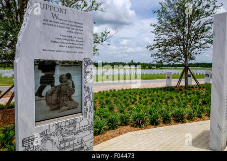A photograph on a white marble plinth at the Patriot Plaza, Sarasota ...