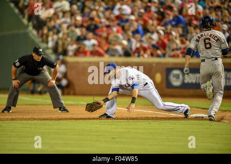 Texas Rangers first baseman Jake Burger tosses the ball during a ...
