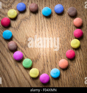 Colorful candy hearts on wooden background. Valentine's day Stock Photo ...