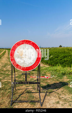 traffic signs and country roads - a faded speed limit 30 mph sign ...