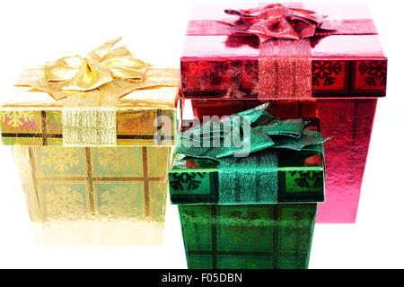 Three gift boxes of different size and color isolated on white Stock ...
