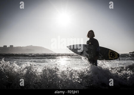 Surfer Pablo Macineira holding surfboard. Orzan Beach. A Coruna ...