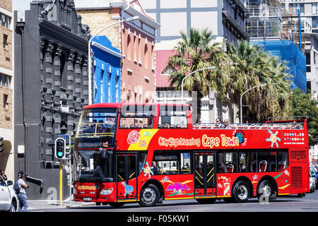 Red bus of City Sightseeing Cape Town and the skyline of Cape Town ...