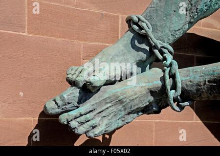 Statue in bronze of the Devil on the Devils Stone outside a church ...