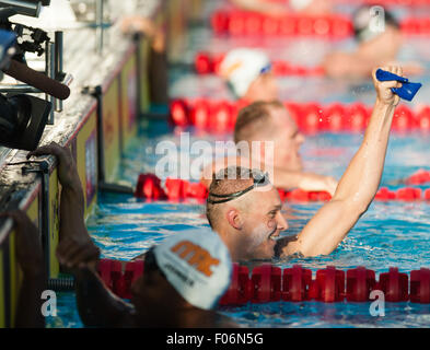 Caeleb Dressel reacts after winning his heat in the men's 100 freestyle ...