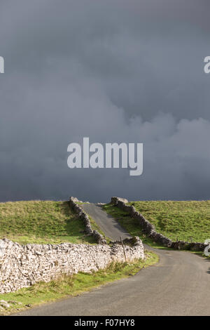 Clouds over the road in country side Stock Photo - Alamy