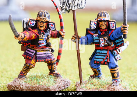 Close-up of metal painted scale model figures. Mounted Japanese samurai ...