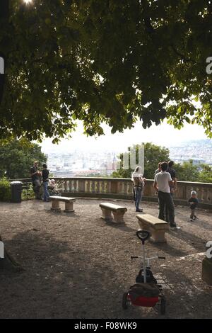View of city of Stuttgart overlooking tourists standing on Eugensplatz ...