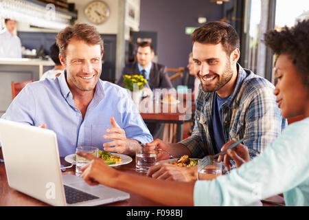Group of friends at lunch in a restaurant Stock Photo - Alamy