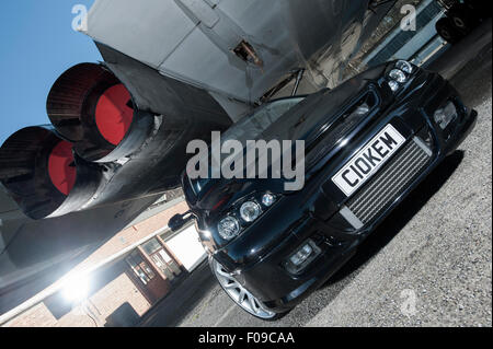 Modified Mk3 Vauxhall Astra car parked under a Concorde airliner Stock ...