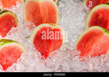 Parts of watermelon on ice on farmer market Stock Photo - Alamy