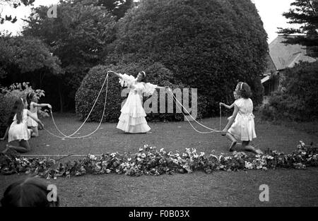 Girls dancing in garden Stock Photo - Alamy