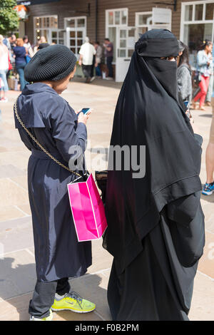A Muslim Woman Wearing A Burka Shopping At The Fendi Luxury Fashions ...