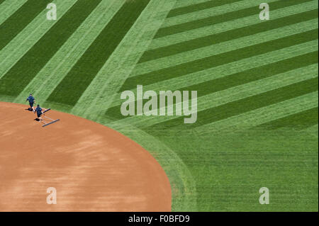 Baseball field abstract patterns with ground crew preparing the field ...