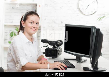 pretty young woman video editor working in studio Stock Photo - Alamy
